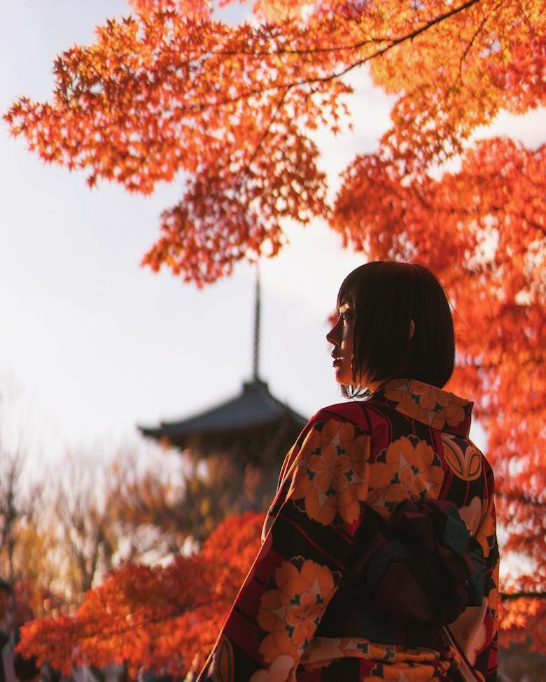 Women in cute and flowery kimonos standing quietly in landscapes of ...
